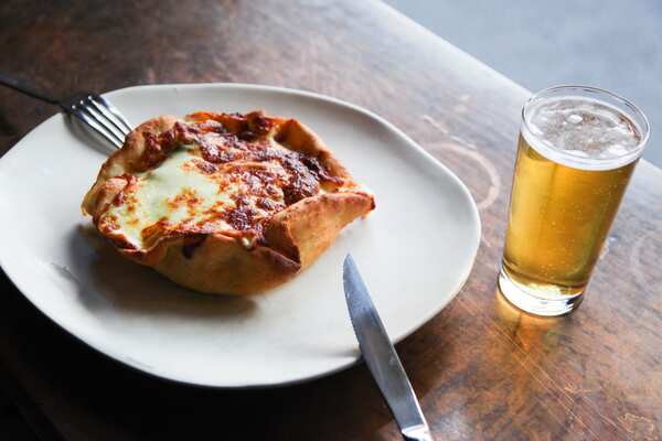 We've found the ultimate food hybrid: the pizza pie at Baller | SBS Food