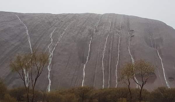 Uluru closed after record-breaking rain turns site into a giant ...