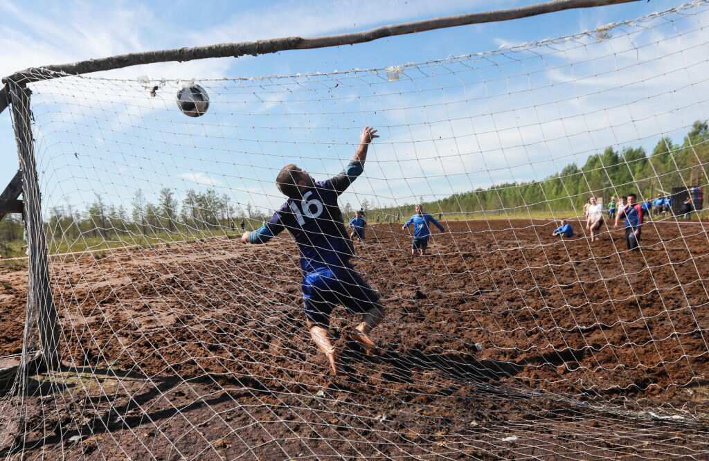 Players get down and dirty at swamp football World Cup | SBS Sport